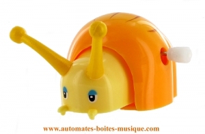 Mechanical automaton animal : orange snail made of plastic.