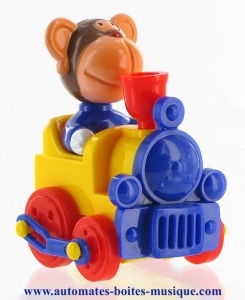 Mechanical automaton animal : Monkey driving a locomotive made of plastic.